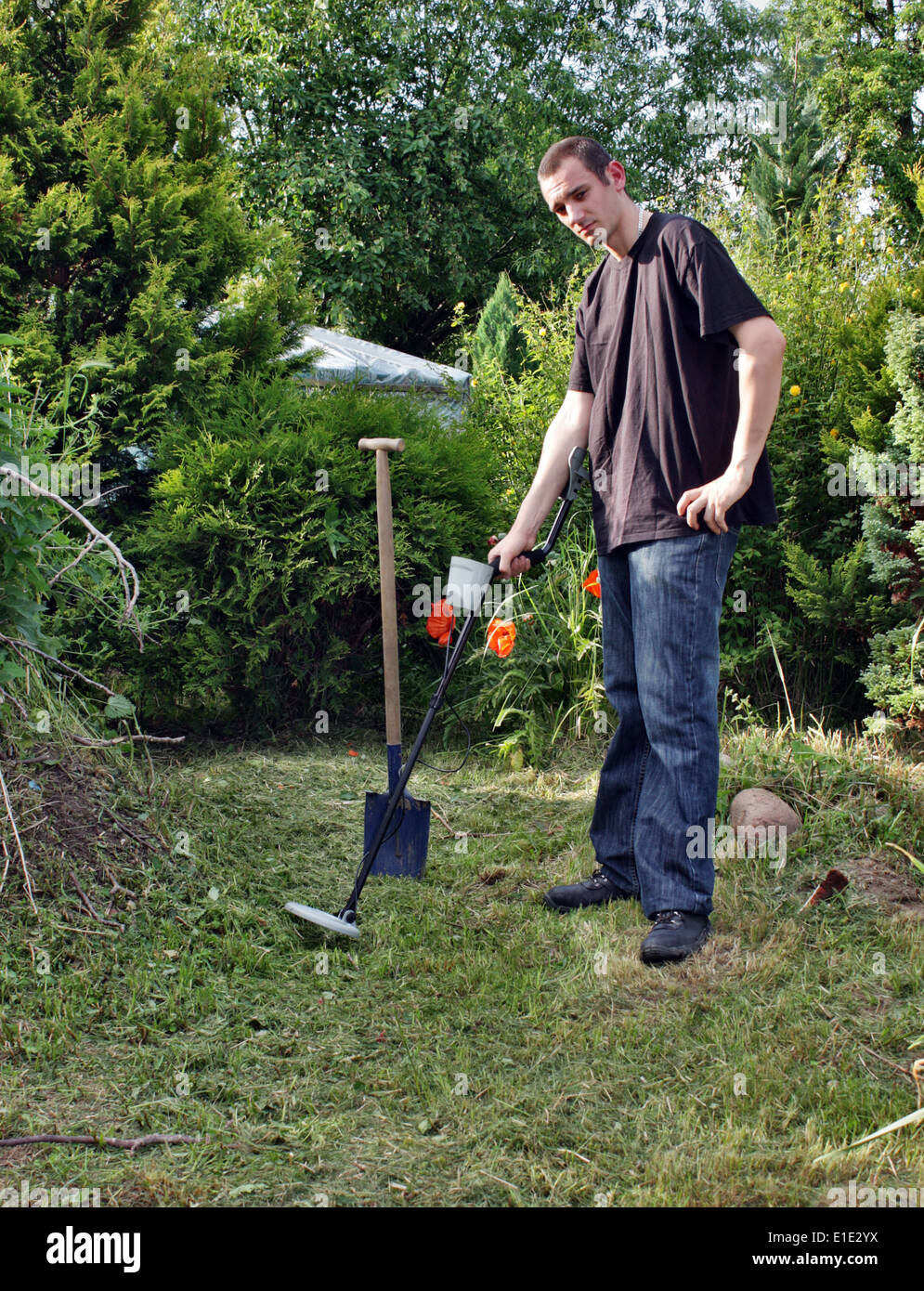 Boy using spade hi-res stock photography and images - Alamy