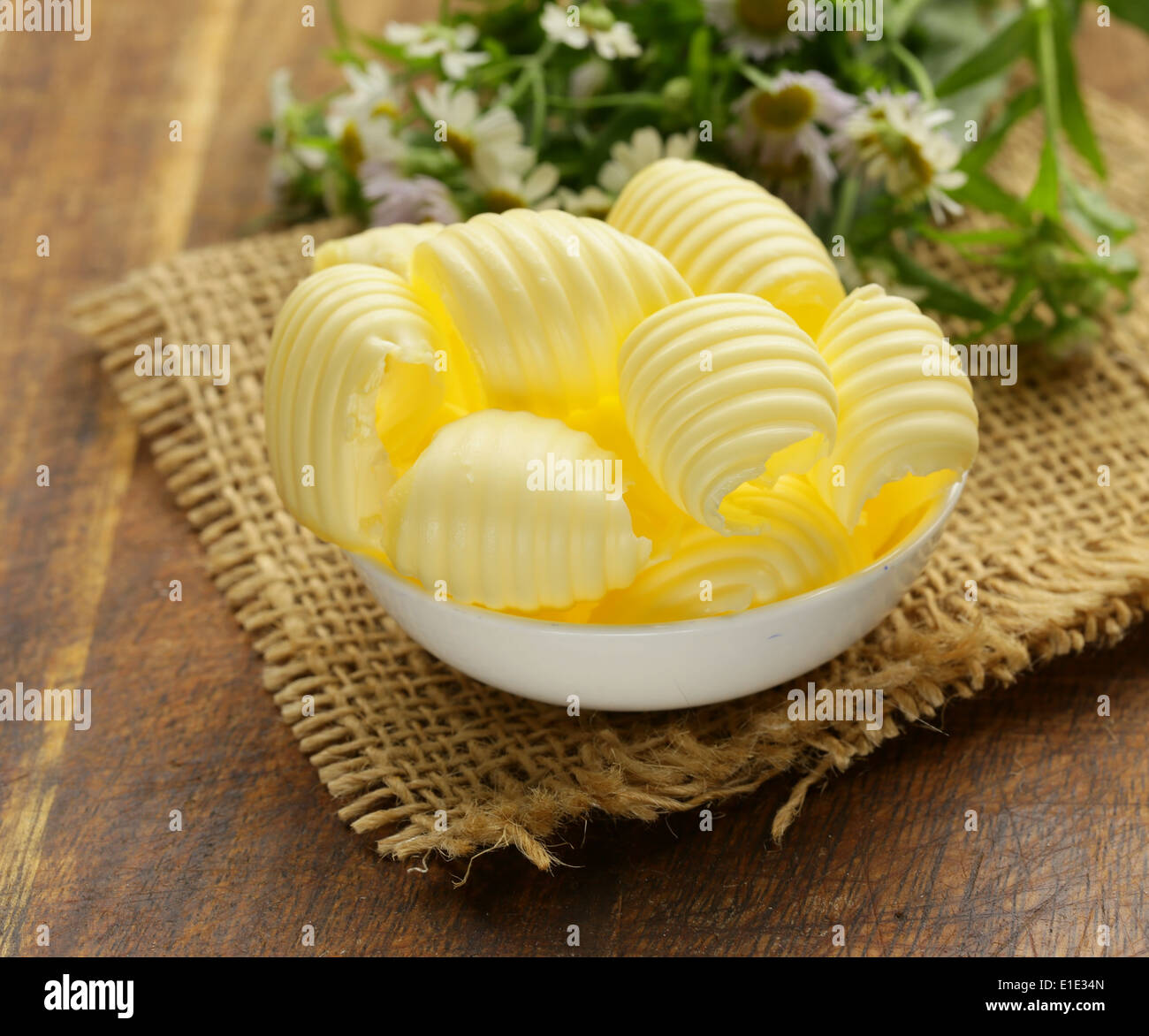 fresh yellow dairy butter in a white bowl Stock Photo - Alamy