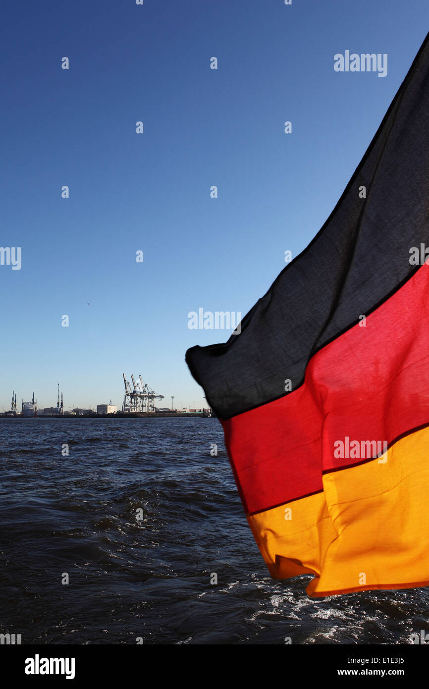 A German flag flutters on a ship in the harbour of Hamburg, Germany ...