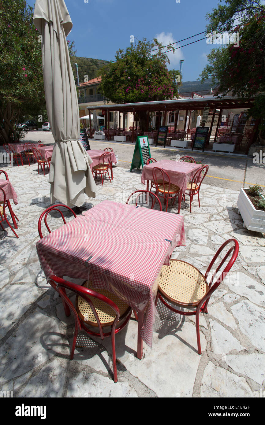 Village of Assos, Kefalonia. Picturesque view of an empty restaurant in ...