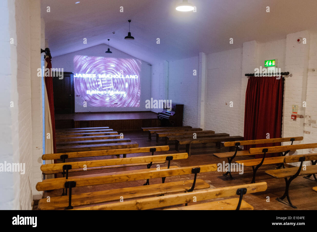 An old-fashioned cinema movie theatre with wooden benches Stock Photo ...