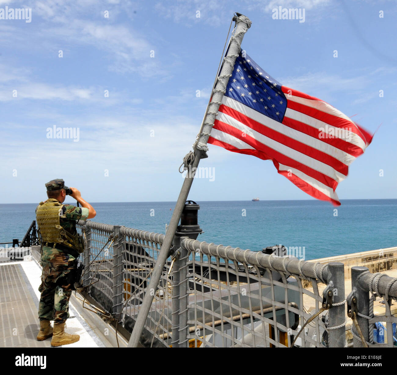 U.S. Navy Master-at-Arms Seaman Shane Miles stands watch on the ...