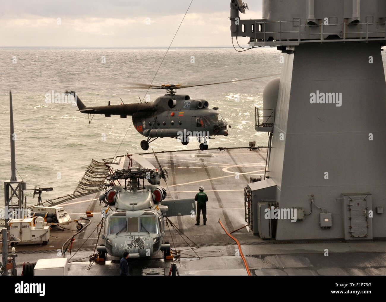 A Lithuanian MI-8 (Hip) military utility helicopter lands aboard USS ...