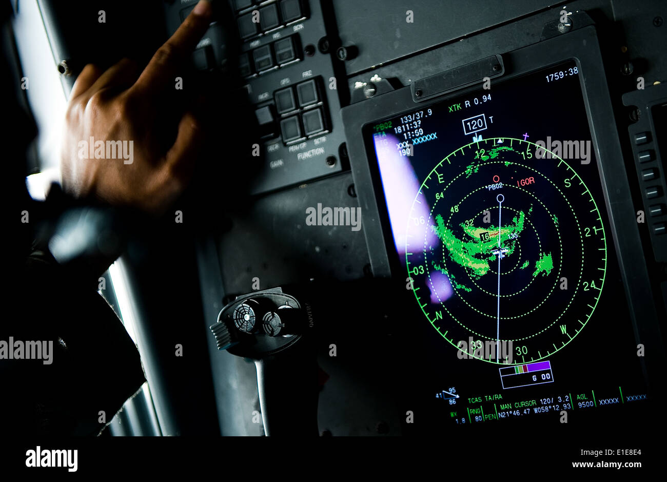 U.S. Air Force Maj. Sid Smith adjusts his instrument panel aboard a WC ...