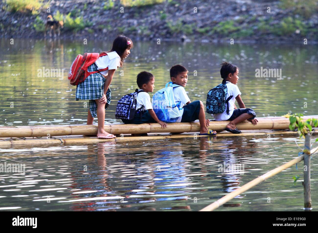 Rizal Province, Philippines. 2nd June, 2014. Students ride a bamboo ...