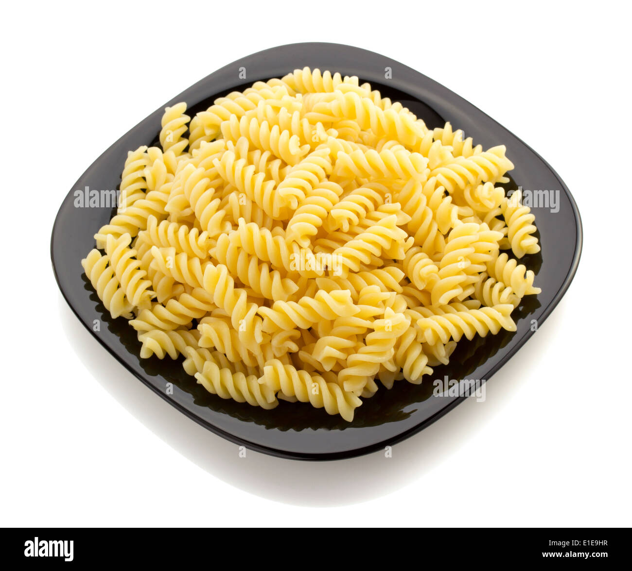 pasta fusilli in plate isolated on white background Stock Photo - Alamy