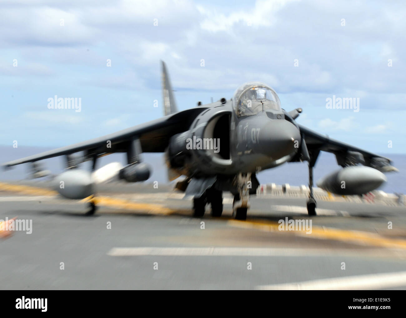 An AV-8B Harrier aircraft prepares to take off from the flight deck of ...