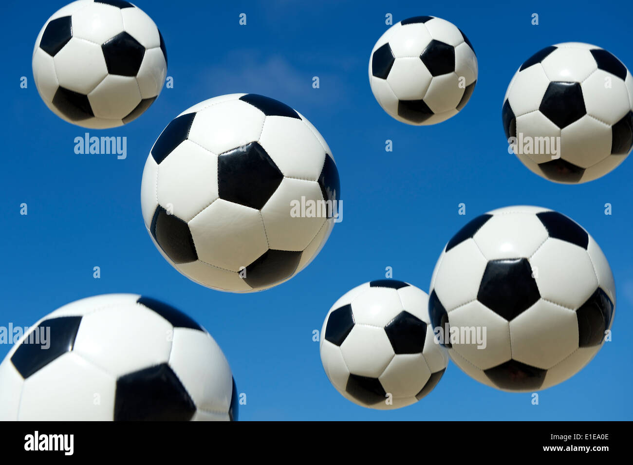 Group of classic black and white soccer ball football floating raining ...