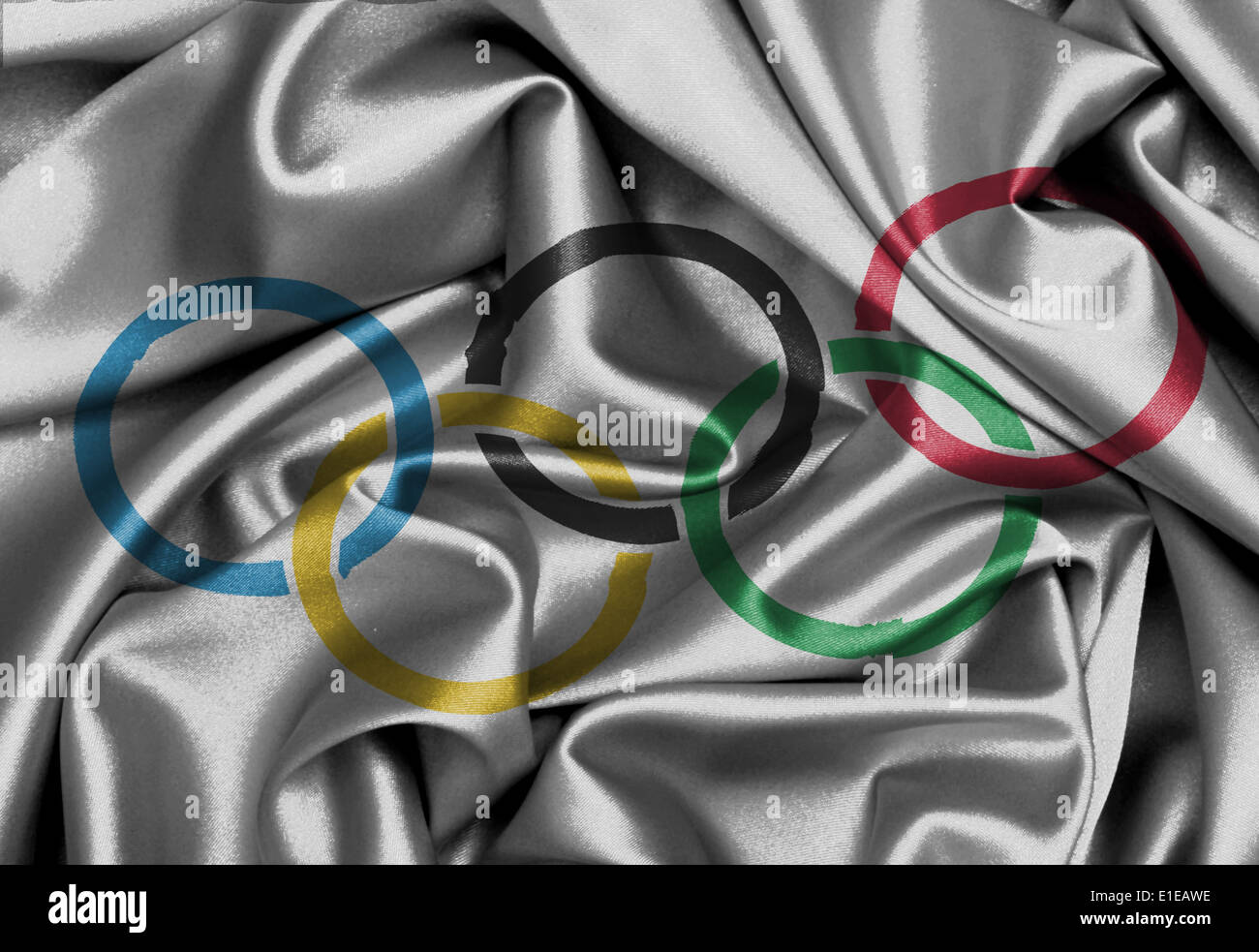 Satin flag with emblem, the olympic rings Stock Photo - Alamy