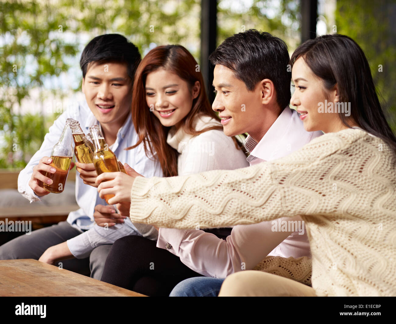 Cheerful friends clinking hi-res stock photography and images - Alamy