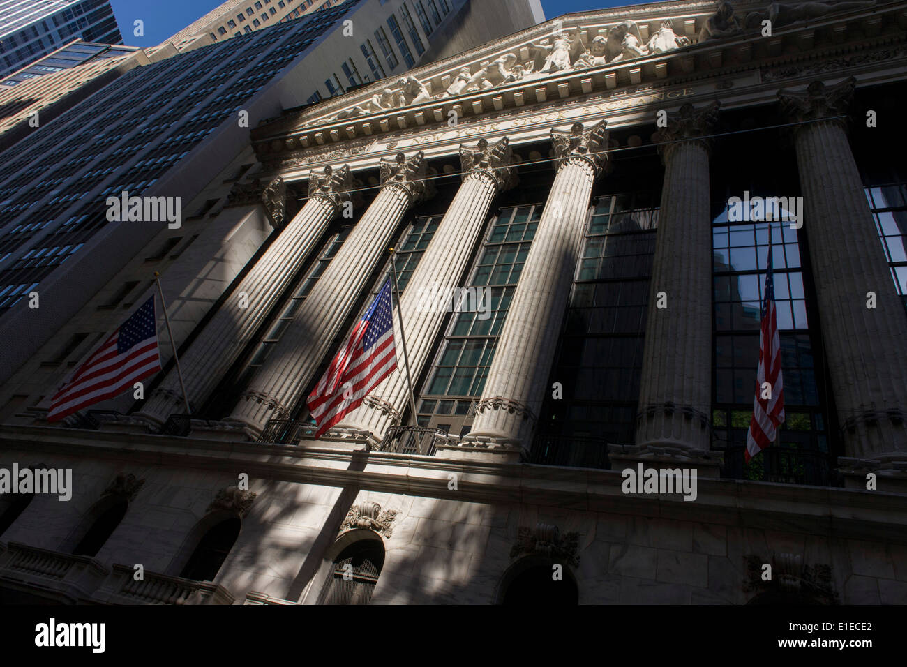 Classical pillars and American flag hanging in front of the New York ...