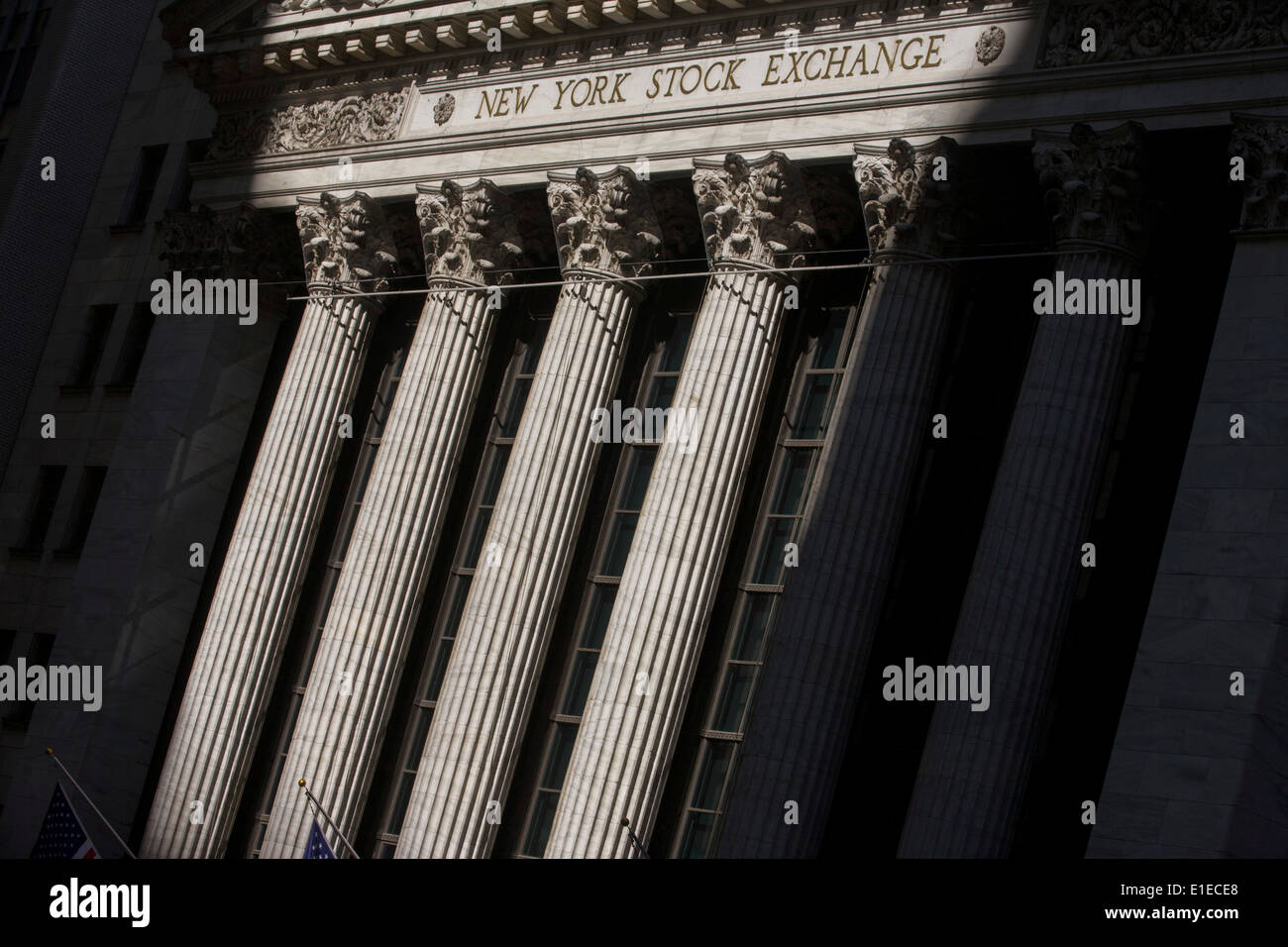 Classical pillars and American flag hanging in front of the New York ...