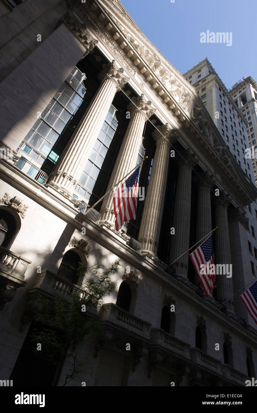 Classical pillars and American flag hanging in front of the New York ...