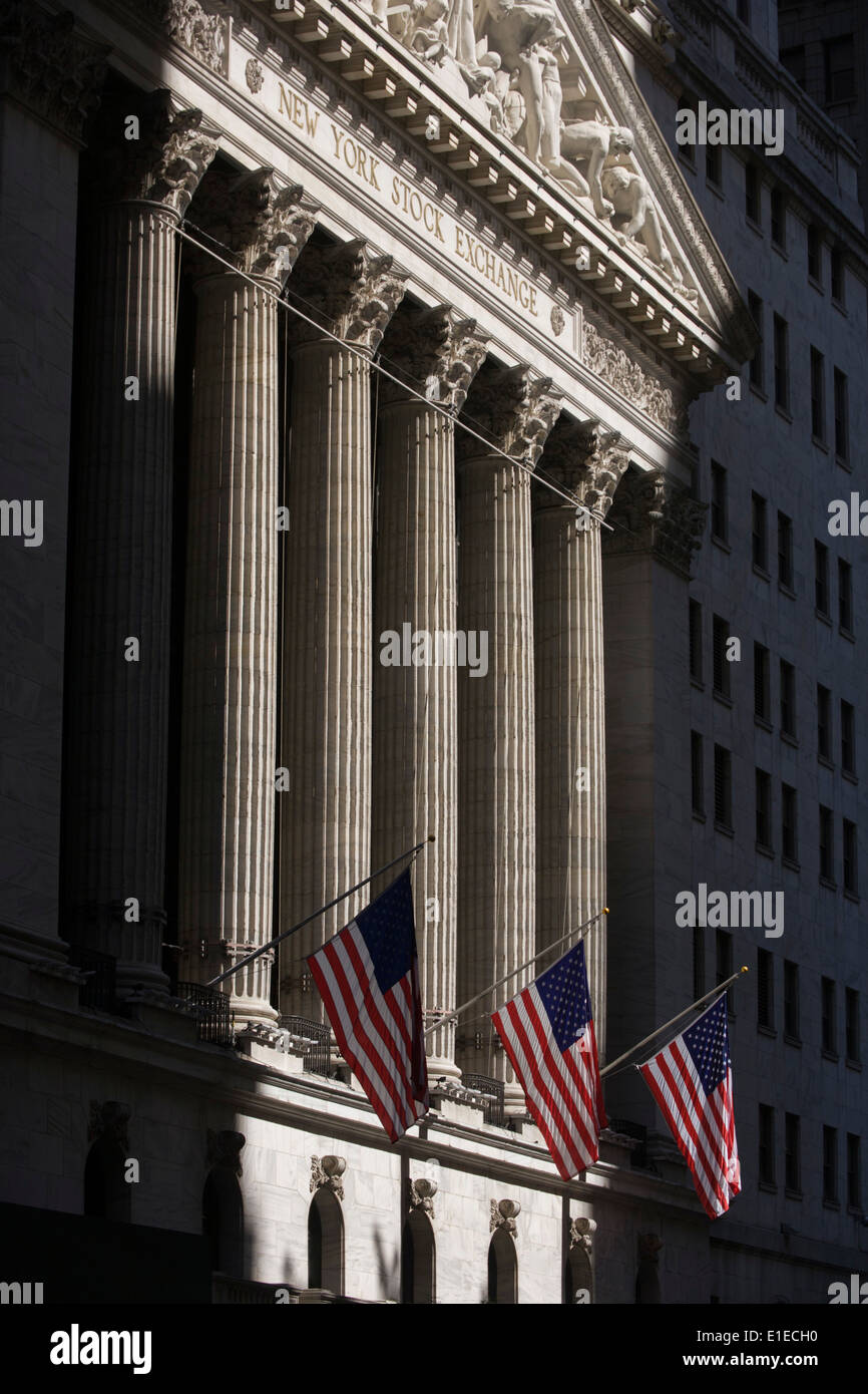 Classical pillars and American flag hanging in front of the New York ...