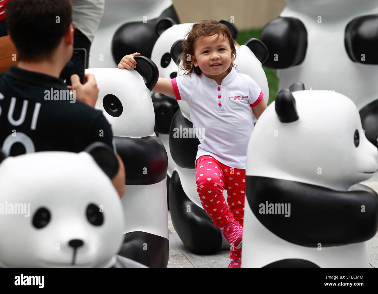 Shanghai, China. 2nd June, 2014. A child poses for photos with lovely ...