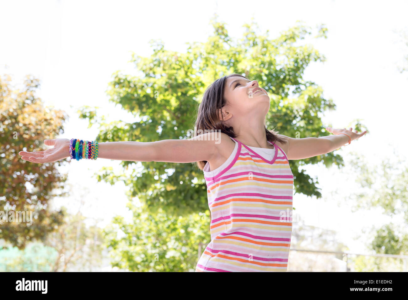 Happy child with open arms outdoors Stock Photo - Alamy