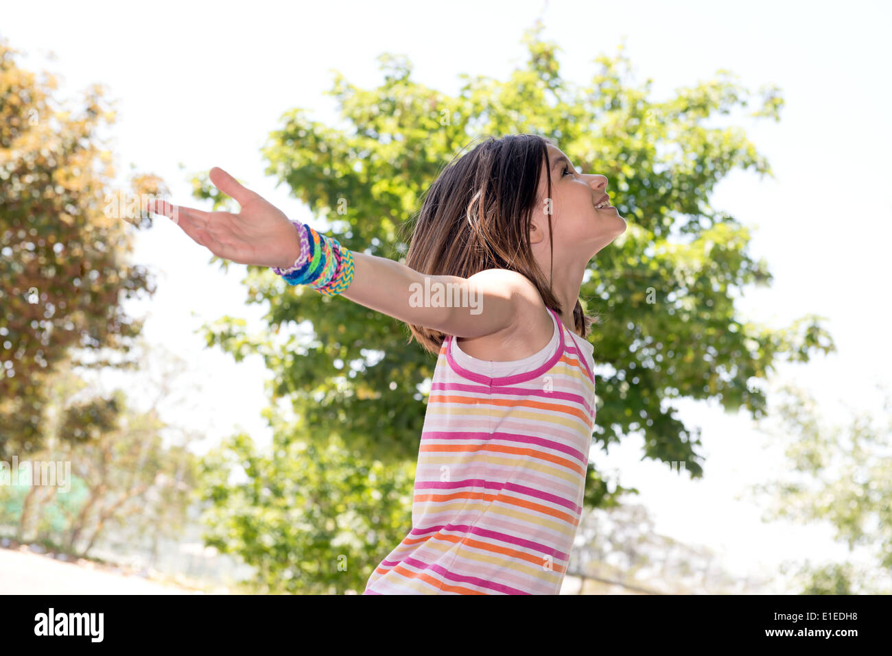 Happy child with open arms outdoors Stock Photo - Alamy