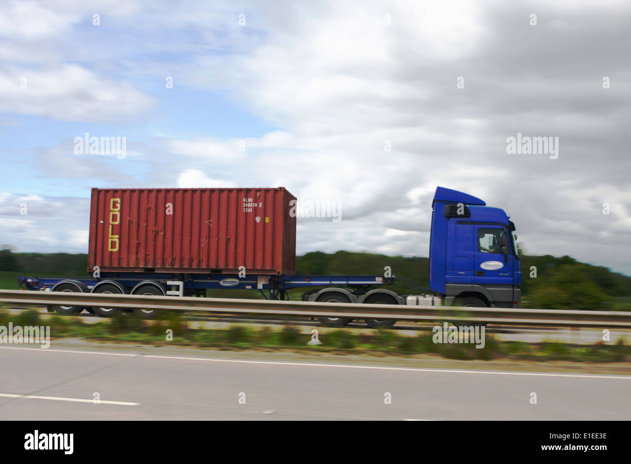 A Wincanton truck hauling a Gold shipping container along the A46 in ...