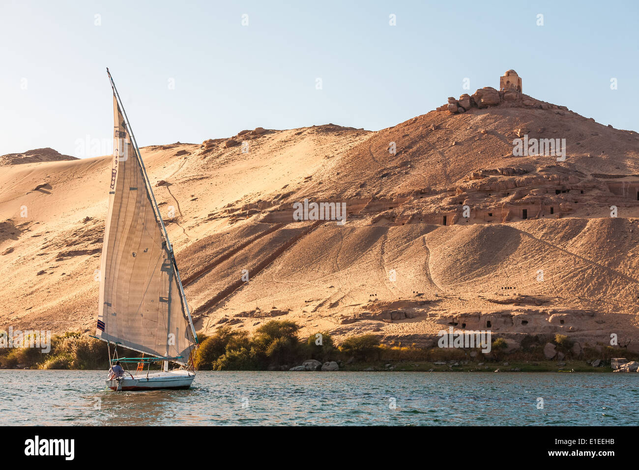 Faluka sailboat sailing on river Nile with abandoned mosque, Aswan ...