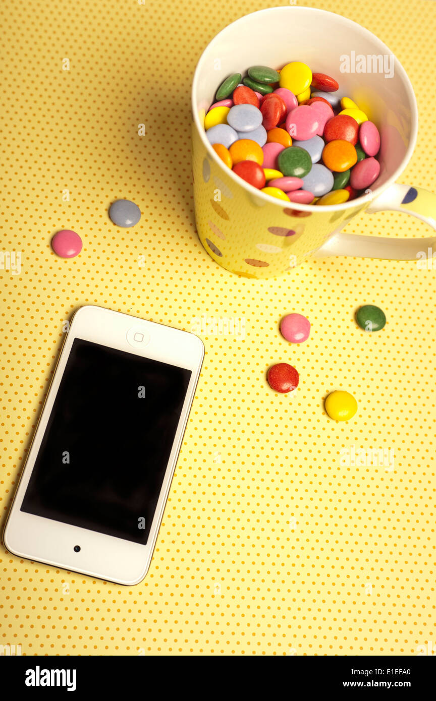 colorful candies and smartphone Stock Photo - Alamy