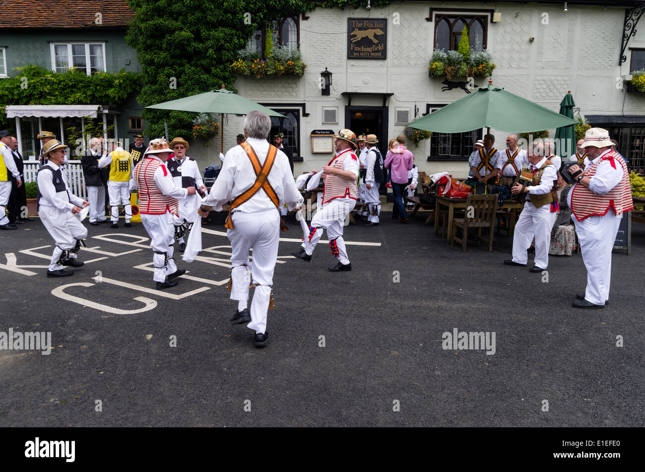 Morris men dancing at the Fox Inn Finchingfield Essex, UK on 31st May ...