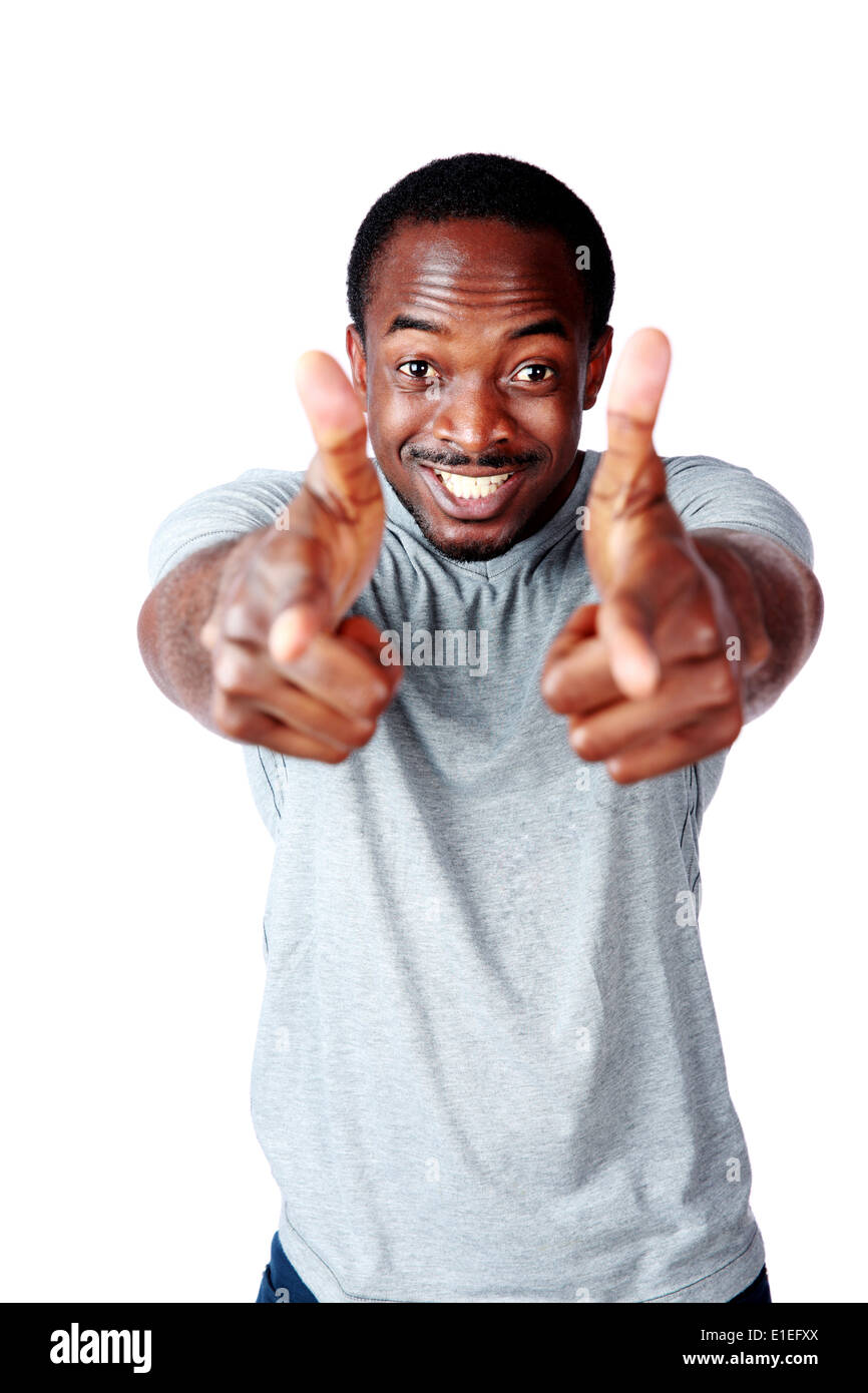 Happy african man with two hands guns sign gesture pointing at you ...