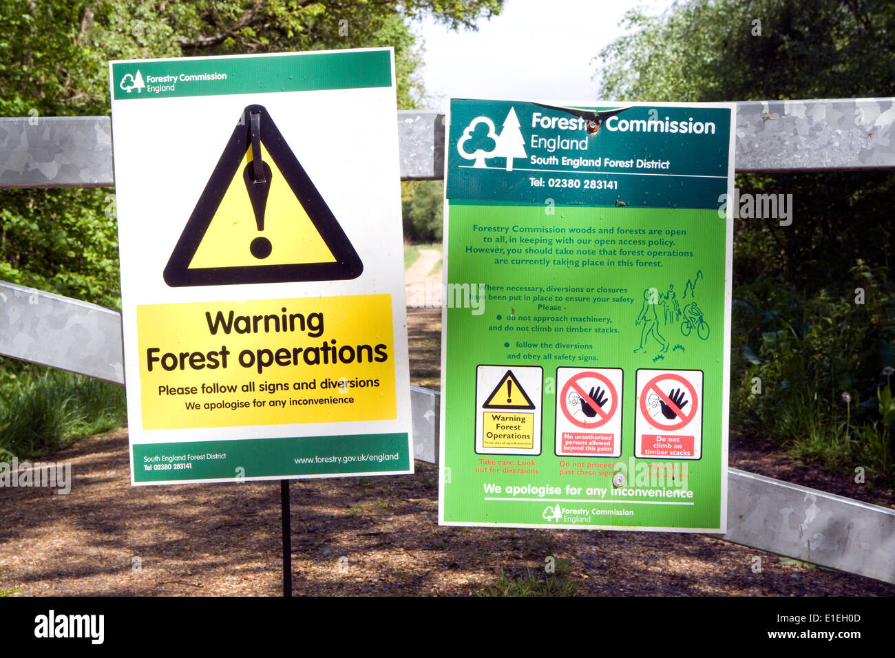 Forest track barrier & signage Stock Photo - Alamy