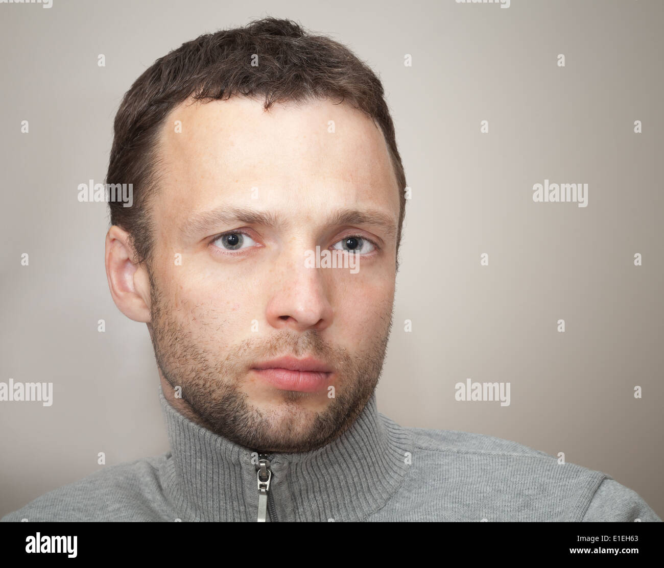 Young serious Caucasian Man. Close up studio portrait Stock Photo - Alamy Young serious Caucasian Man. Close up studio portrait Stock Photo - Alamy