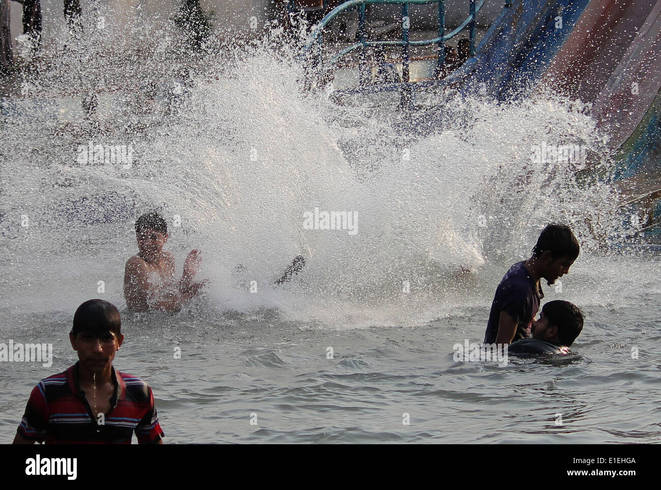 Lahore, Pakistan. 01st June, 2014. Pakistani youngster jumping and ...