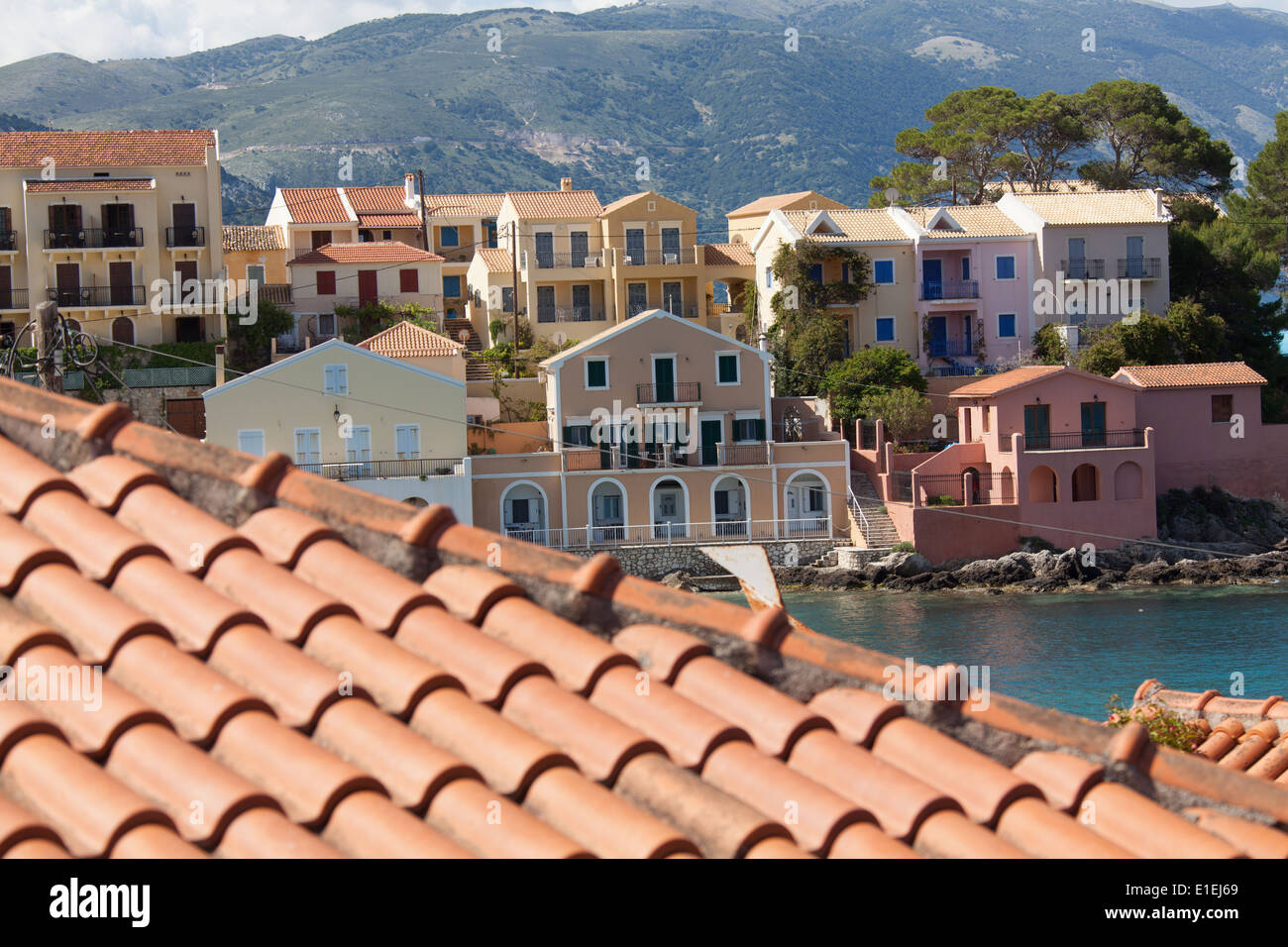 Village of Assos, Kefalonia. Picturesque rooftop view of the brightly ...