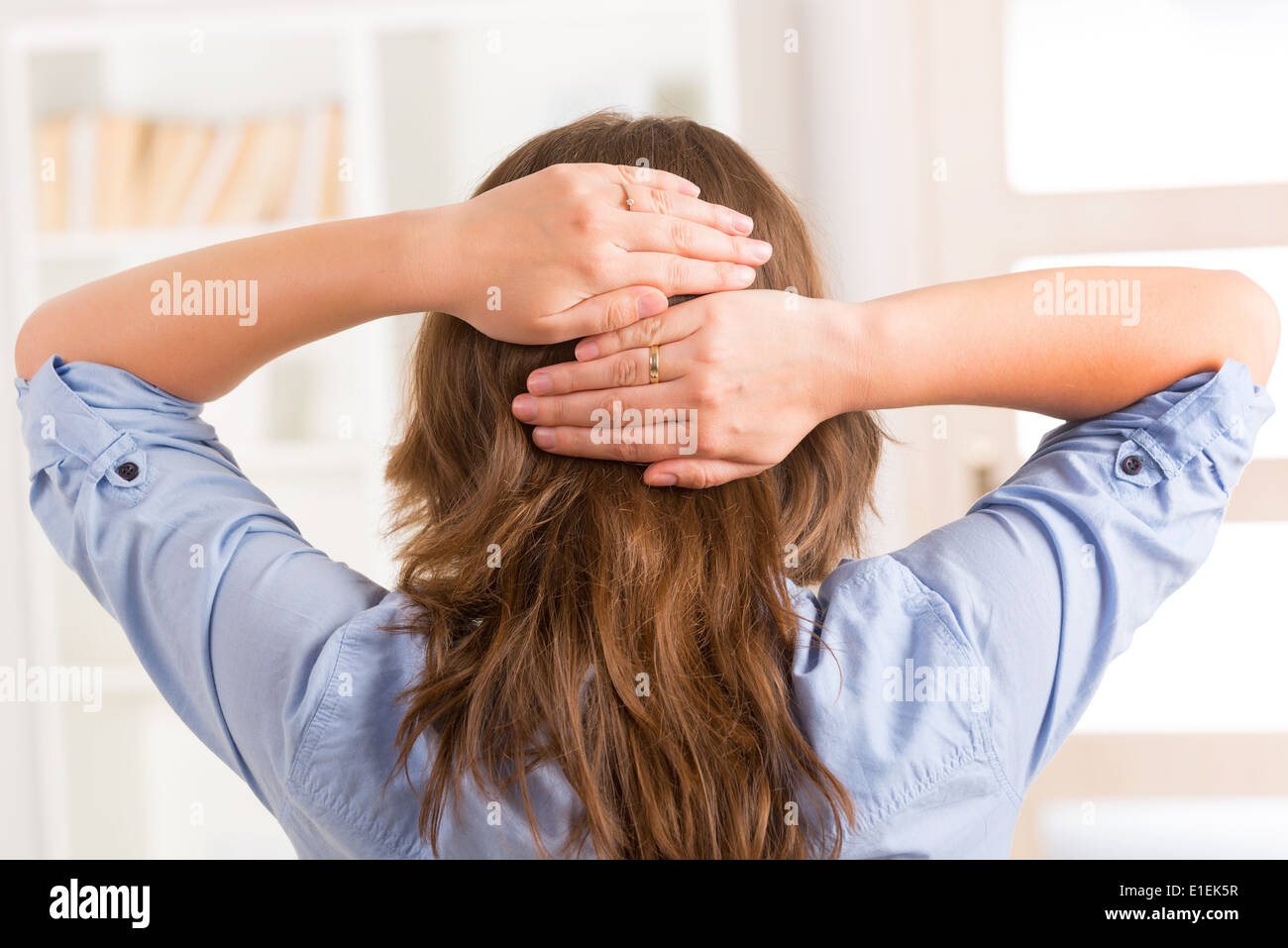 Woman practicing self Reiki transfering energy through palms, a kind of ...