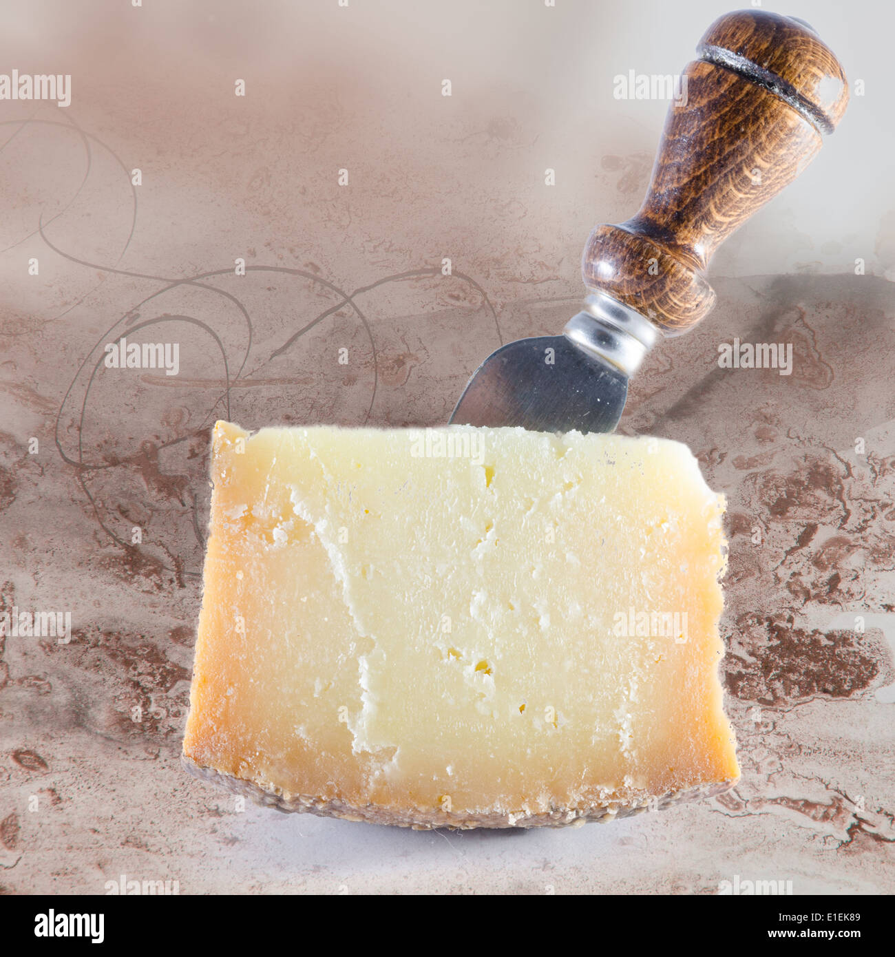Italian sheep cheese and knife Stock Photo - Alamy