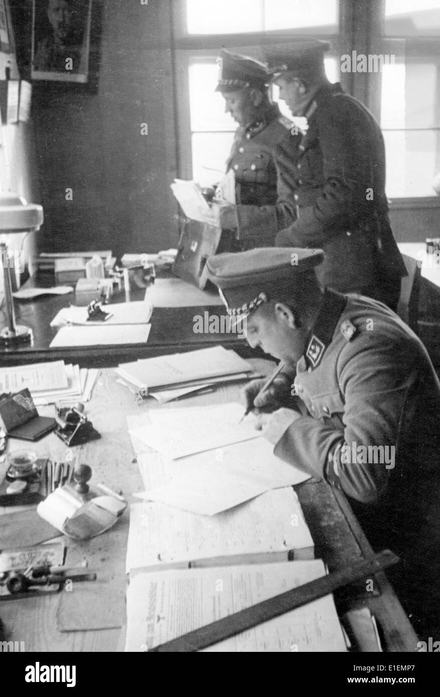 German border guards sit in the customs house on the customs street ...
