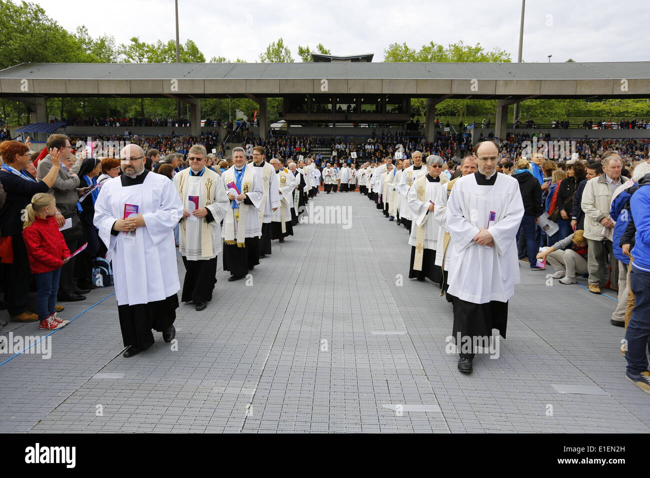 Regensburg, Germany. 1st June 2014. The clergy process into the stadium ...