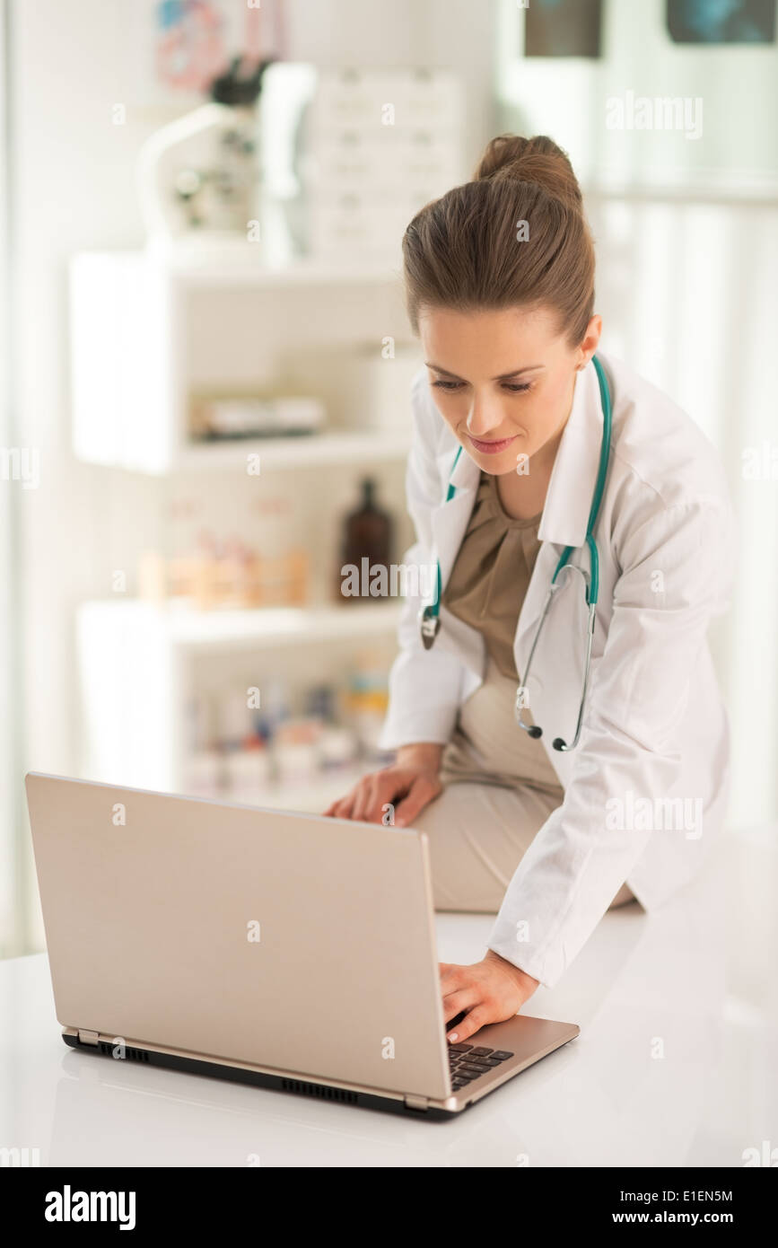 Medical doctor woman working on laptop in office Stock Photo - Alamy