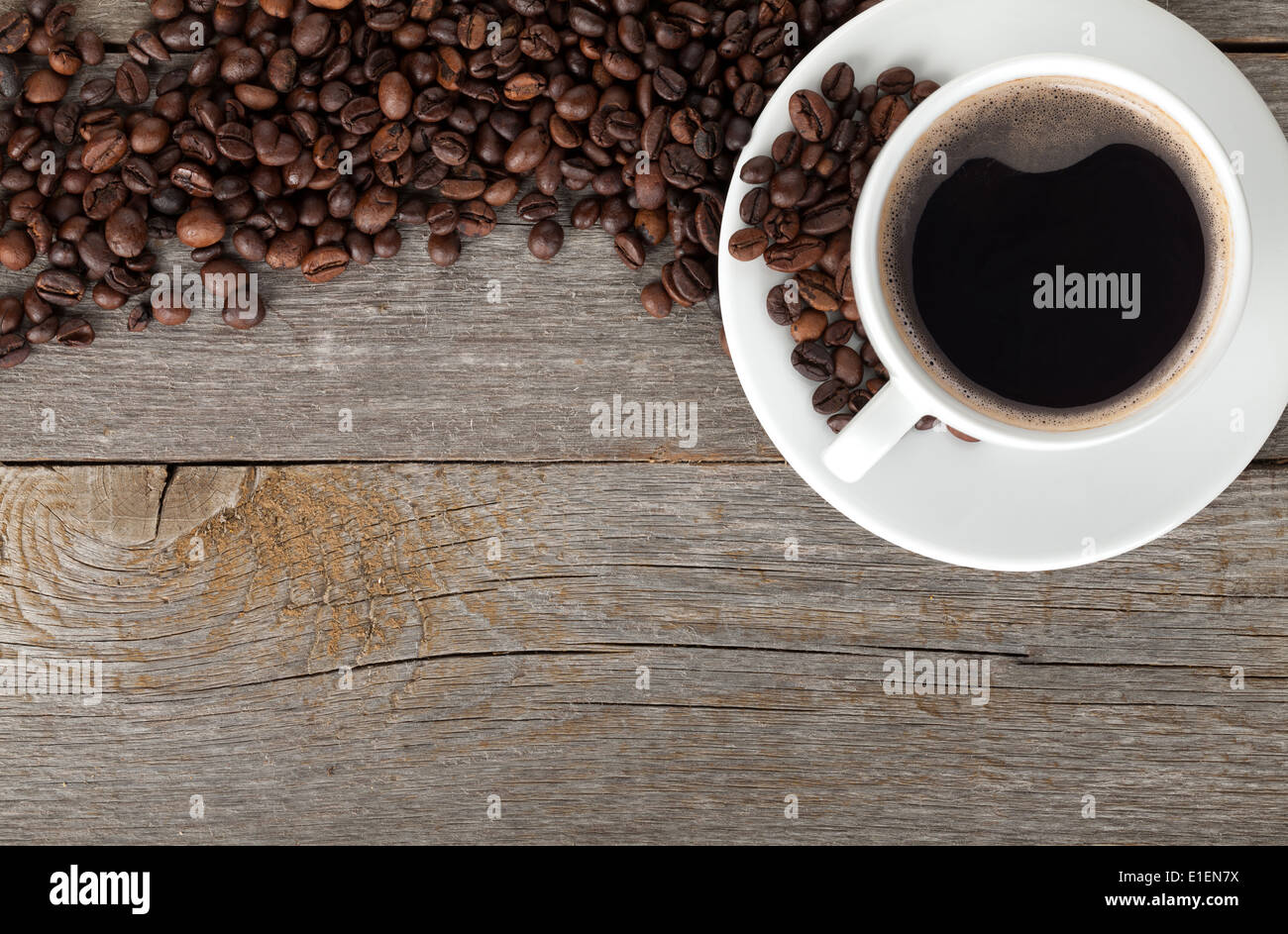 Coffee cup and beans on wooden table background with copy space Stock ...