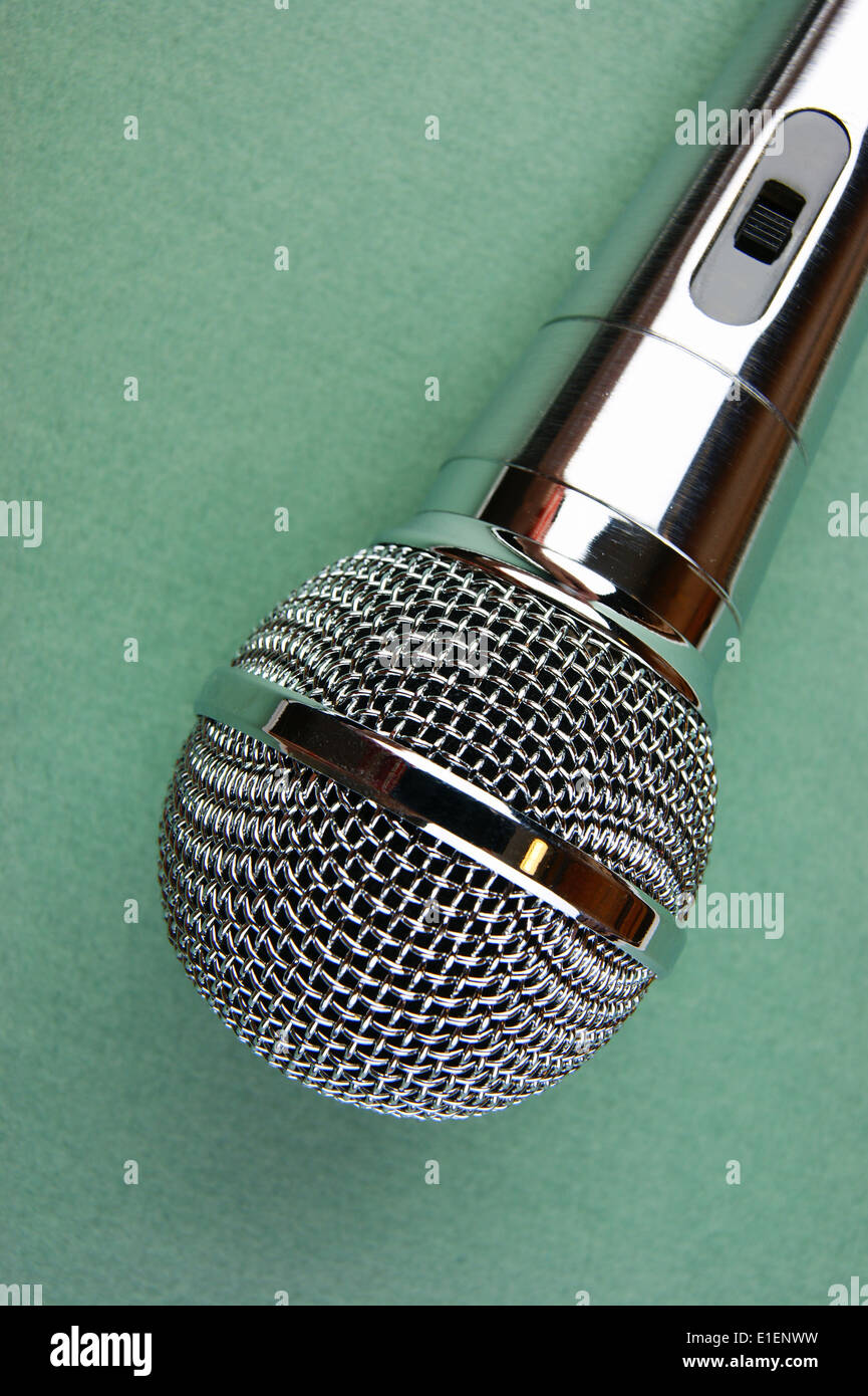 Classic dynamic microphone on a green background Stock Photo - Alamy