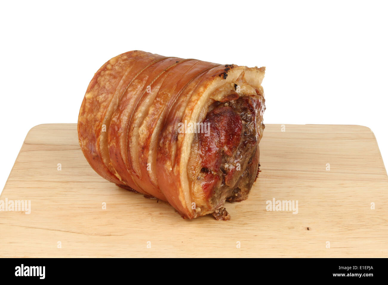 Cooked pork joint on a wooden board against a white background Stock ...
