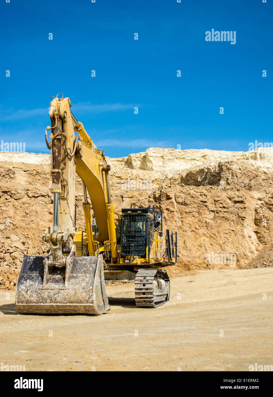 Excavator at quarry mining site Stock Photo - Alamy