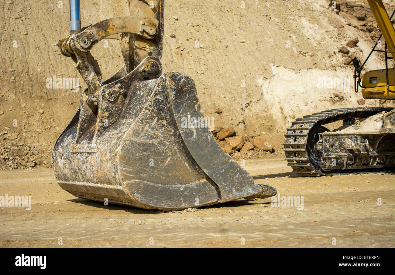 Excavator bucket and tracks Stock Photo - Alamy