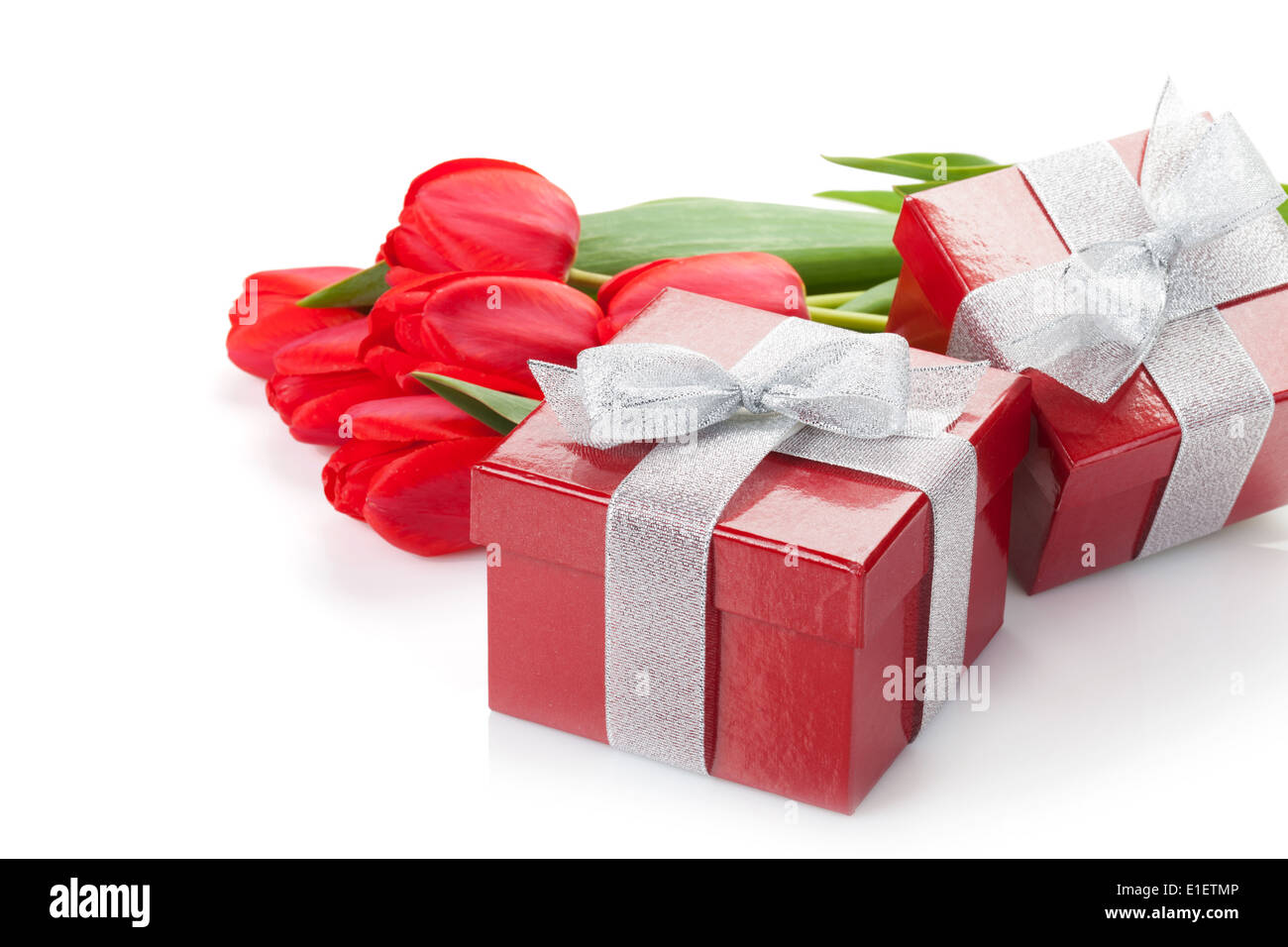 Fresh red tulips with gift boxes. Isolated on white background Stock ...
