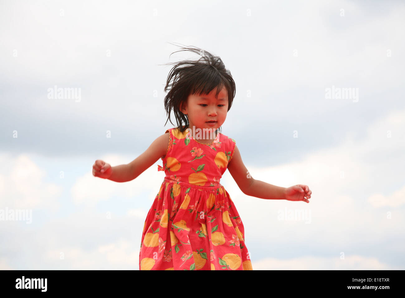 happy child outdoor jumping Stock Photo - Alamy