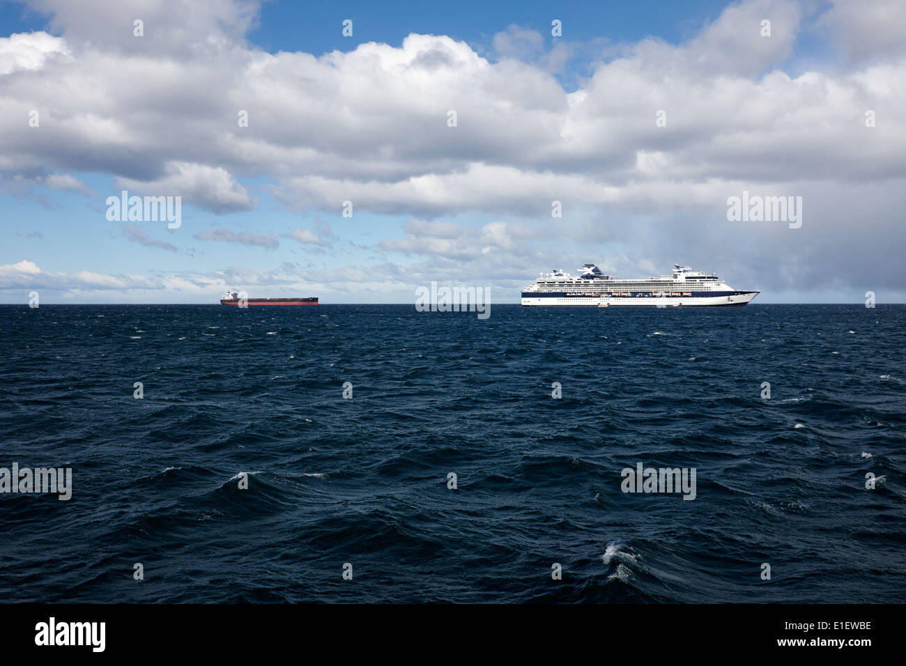 large cruise ship and oil tanker offshore in shallow water port Punta ...