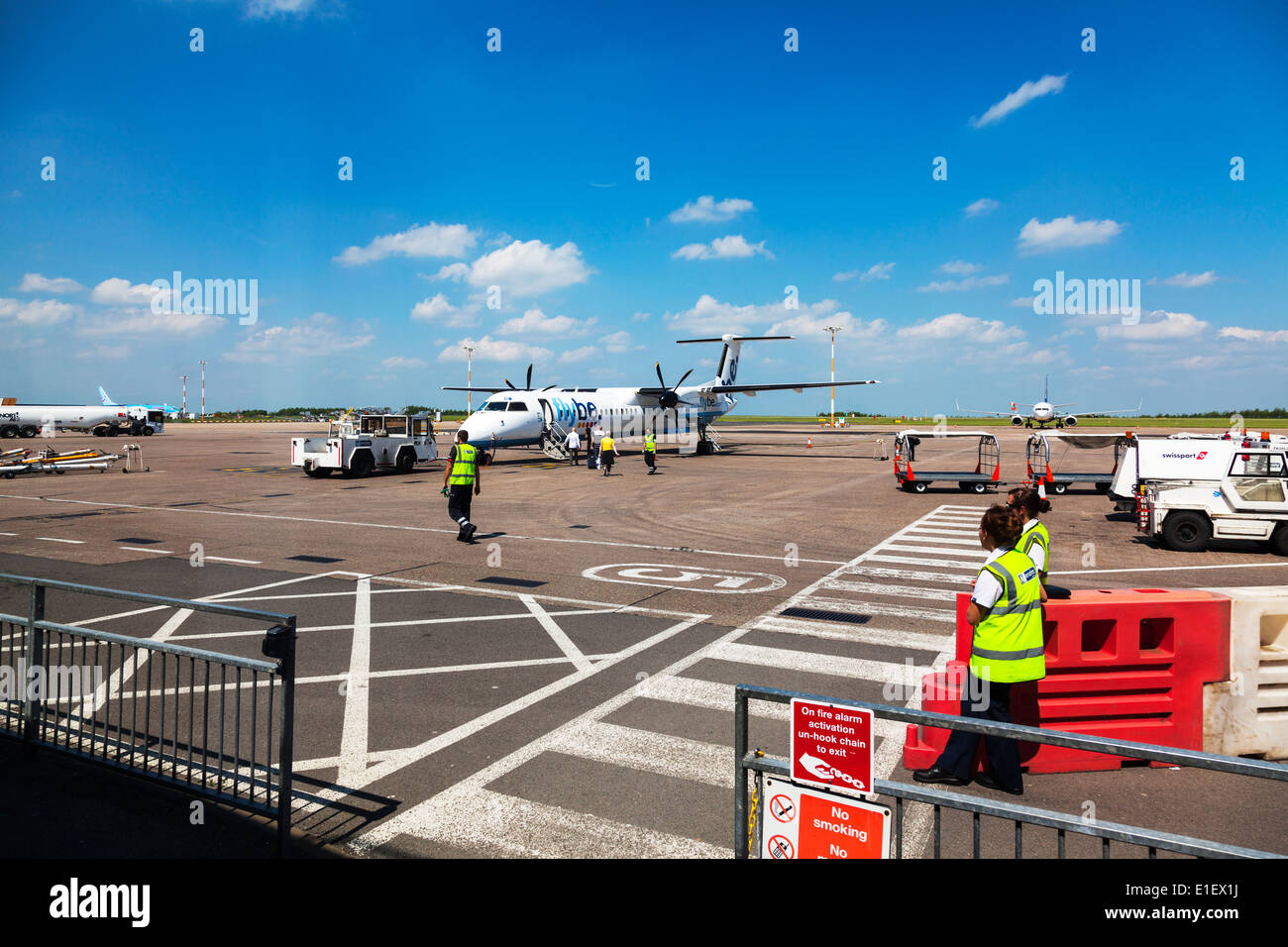 Passengers Boarding flybe plane on tarmac at East Midlands airport ...