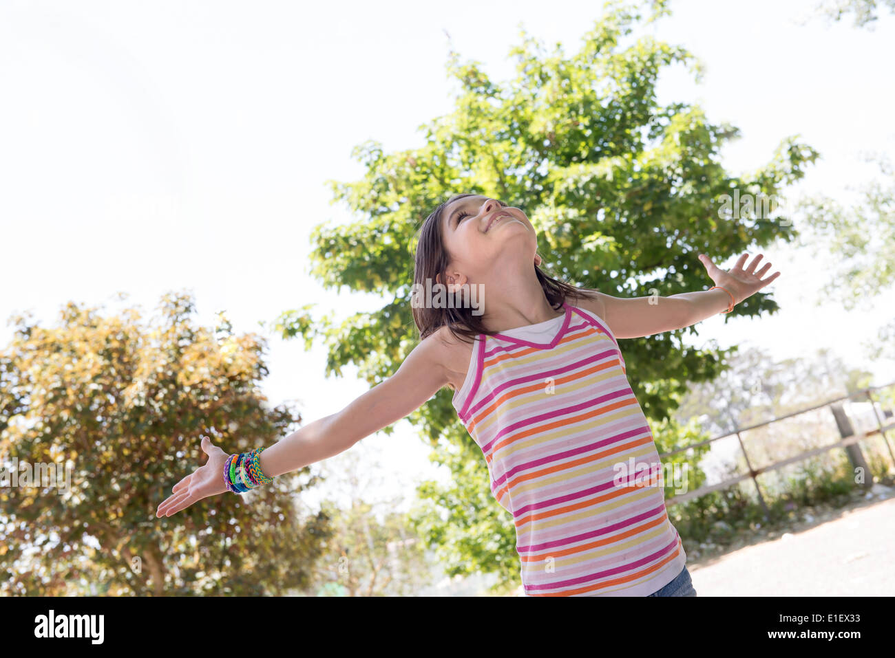 Happy child with open arms outdoors Stock Photo - Alamy