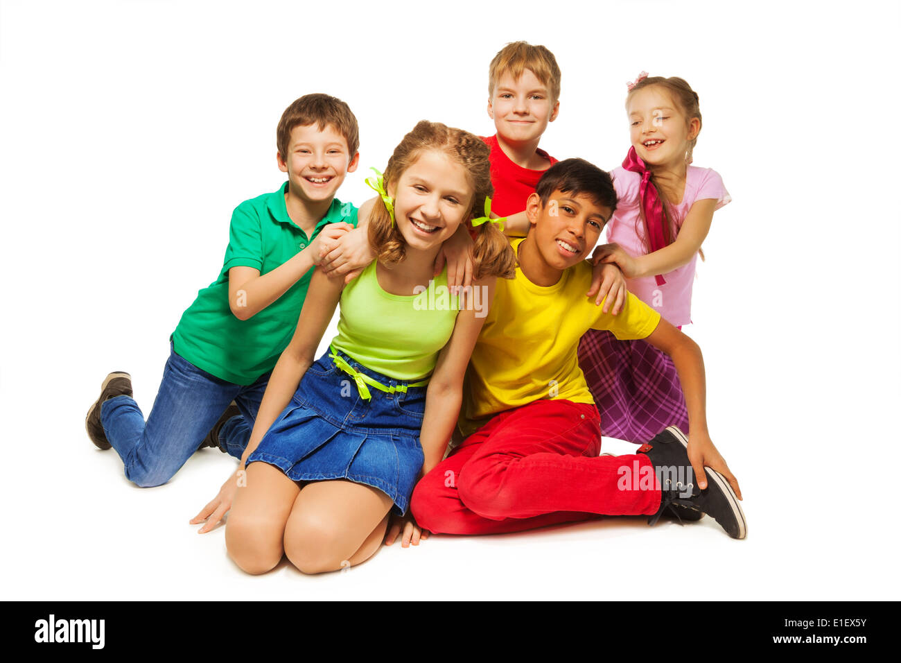 Laughing kids sitting on the floor together Stock Photo - Alamy