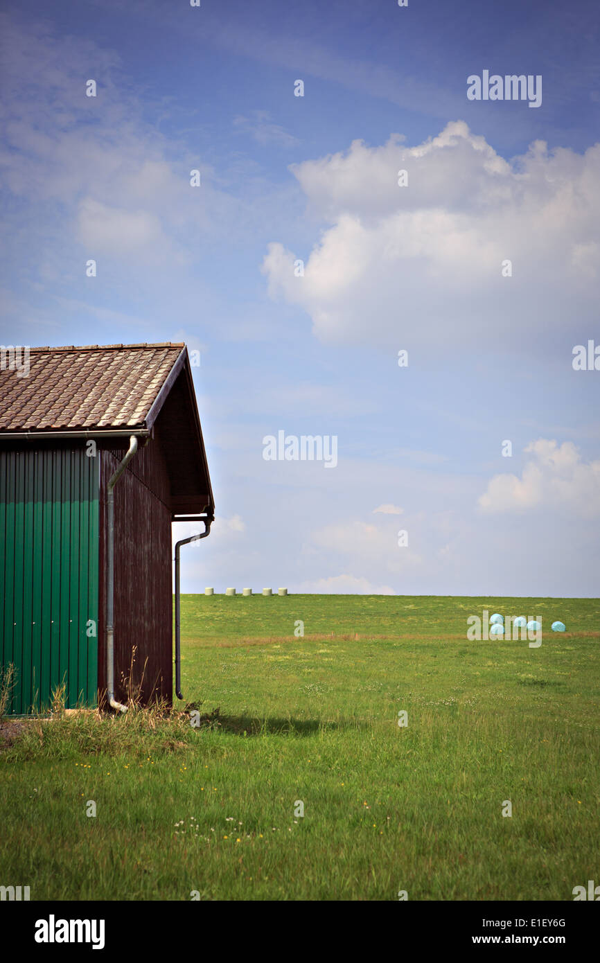 Rural landscape and a agriculture building in Germany Stock Photo - Alamy