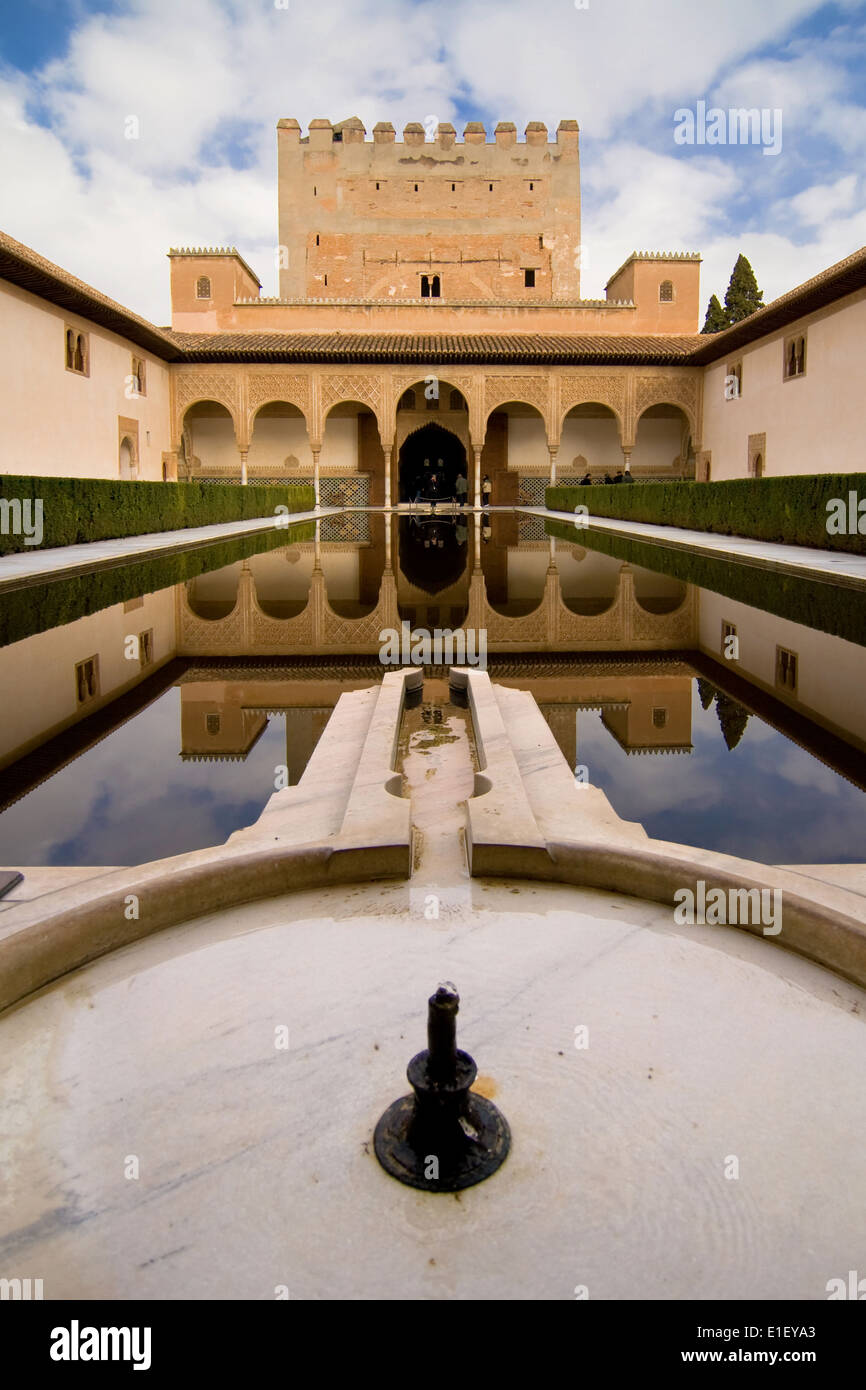 Comares tower reflected in the pond of the Court of the Myrtles in La ...