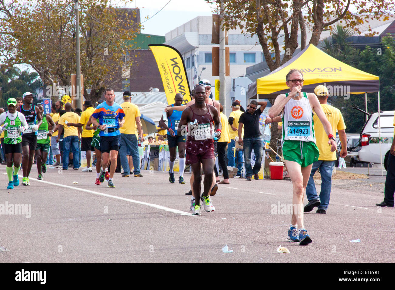 Eight unknown runners competing in the long distance Comrades Ultra ...