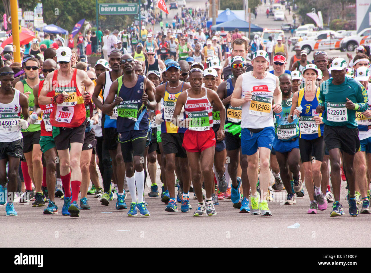 Crowd of runners competing in the long distance Comrades Marathon ...